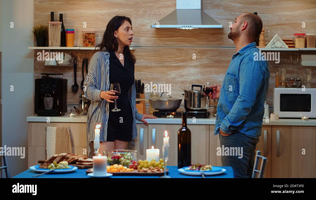 Caucasian young adults fighting during romantic dinner. Frustrated ...