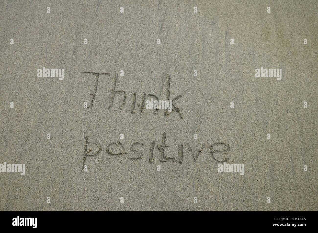 think positive written on the sand beach - positive thinking concept ...