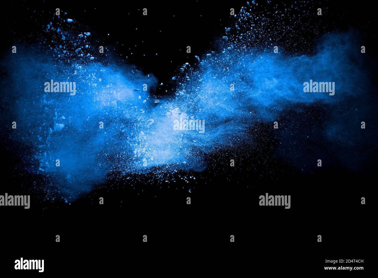 Blue color powder explosion cloud on black background.Closeup of Blue ...