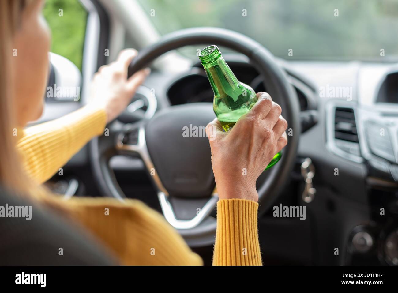 Drunk woman driving car beer hi-res stock photography and images - Alamy