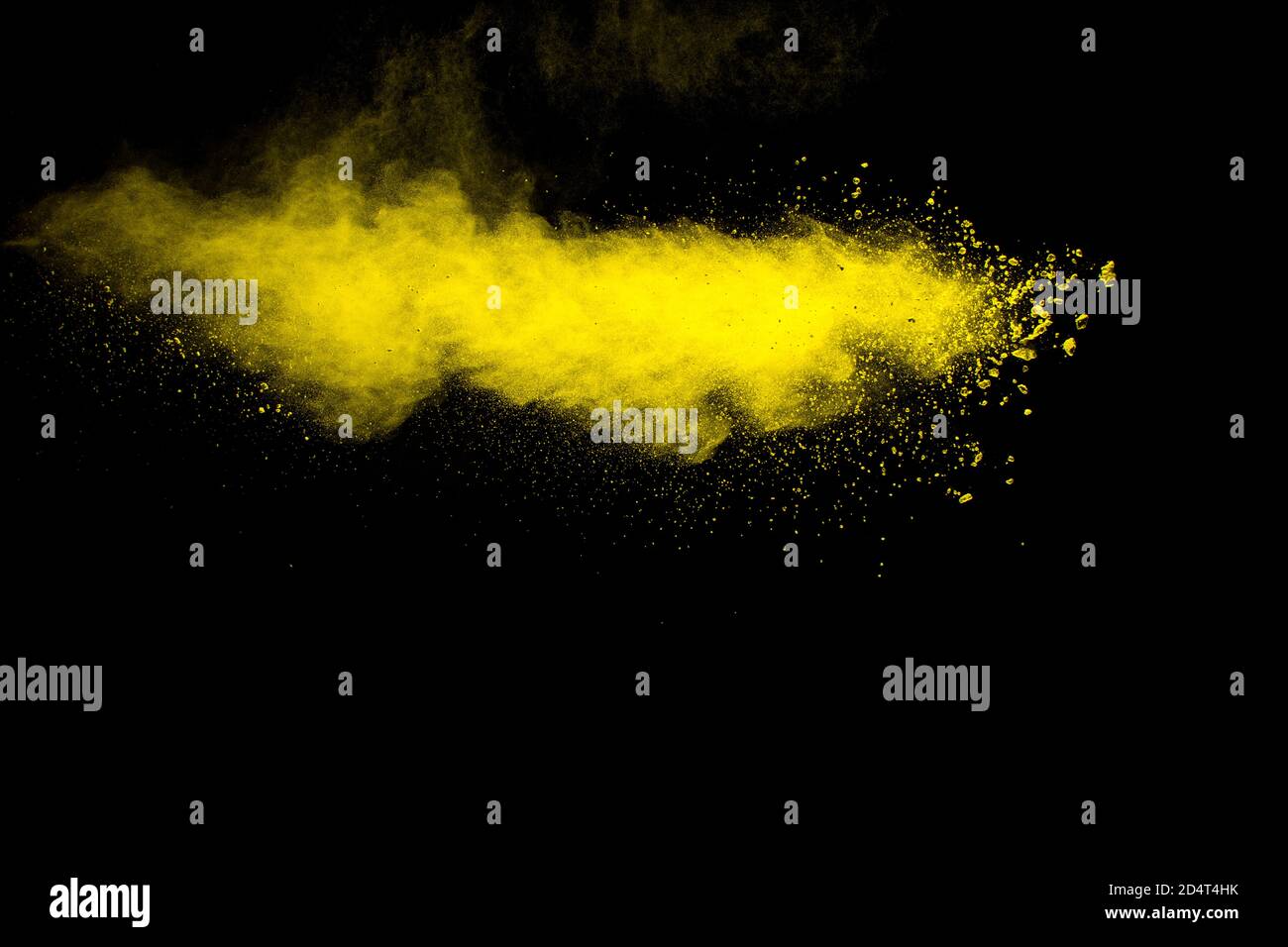 Yellow dust particles explosion on black background.Yellow powder ...
