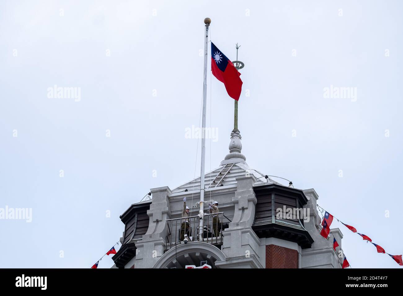 Taiwan's military police raise the national flag during the ceremony of ...