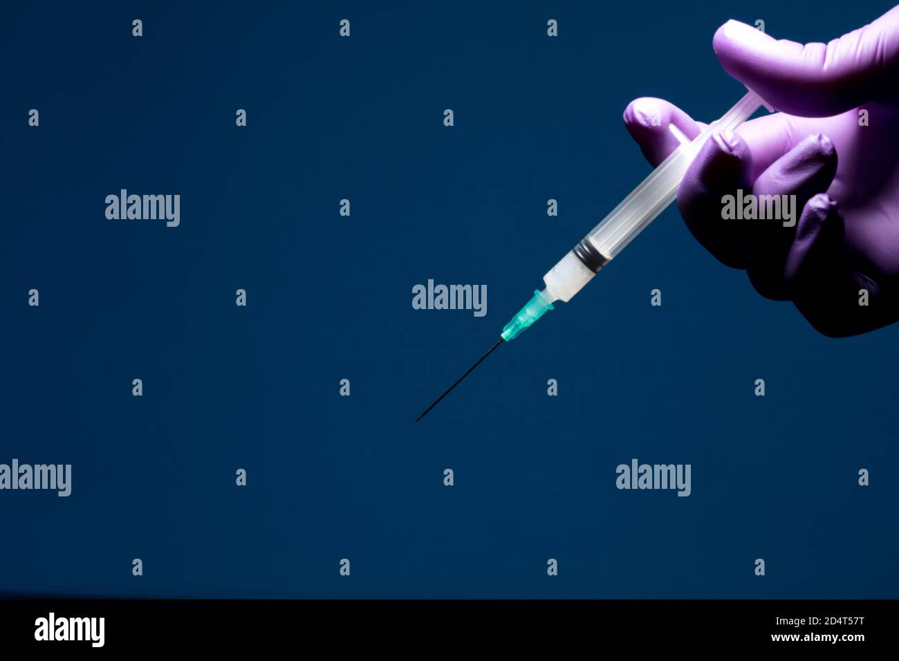 Syringe, medical injection in the hand, palm or fingers. Plastic ...