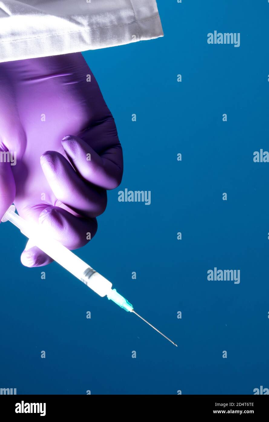 Syringe, medical injection in the hand, palm or fingers. Plastic ...
