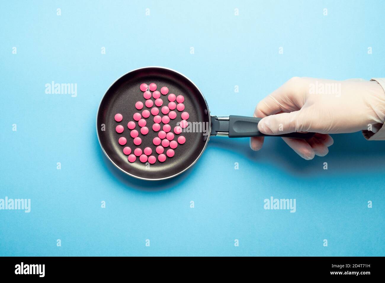 Abstract drug making concept with frying pan and pills Stock Photo - Alamy