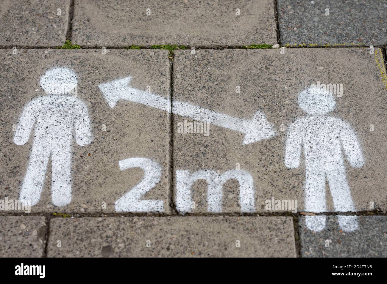 2 metre social distancing signs on the pavement in Cardiff, Wales ...
