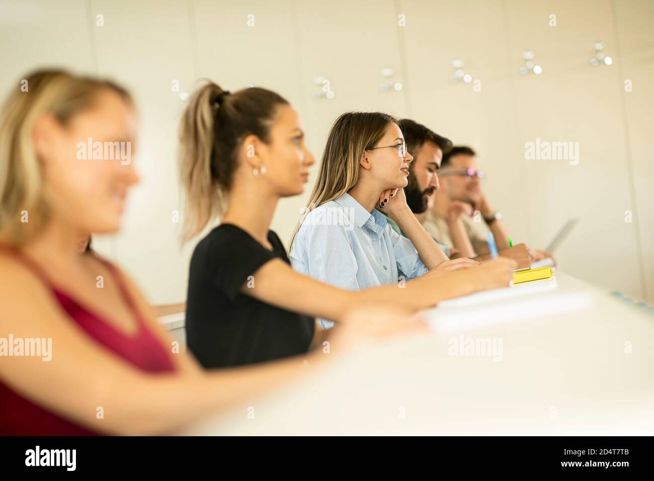 Group of university students in the classroom Stock Photo - Alamy