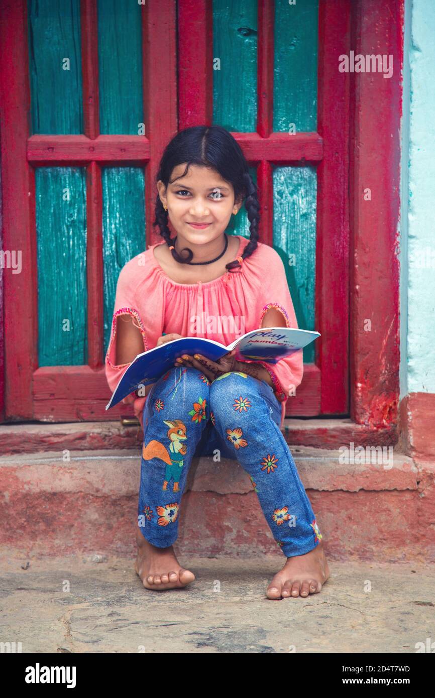 Teenager Village girl of Indian ethnicity seating at corridor and ...
