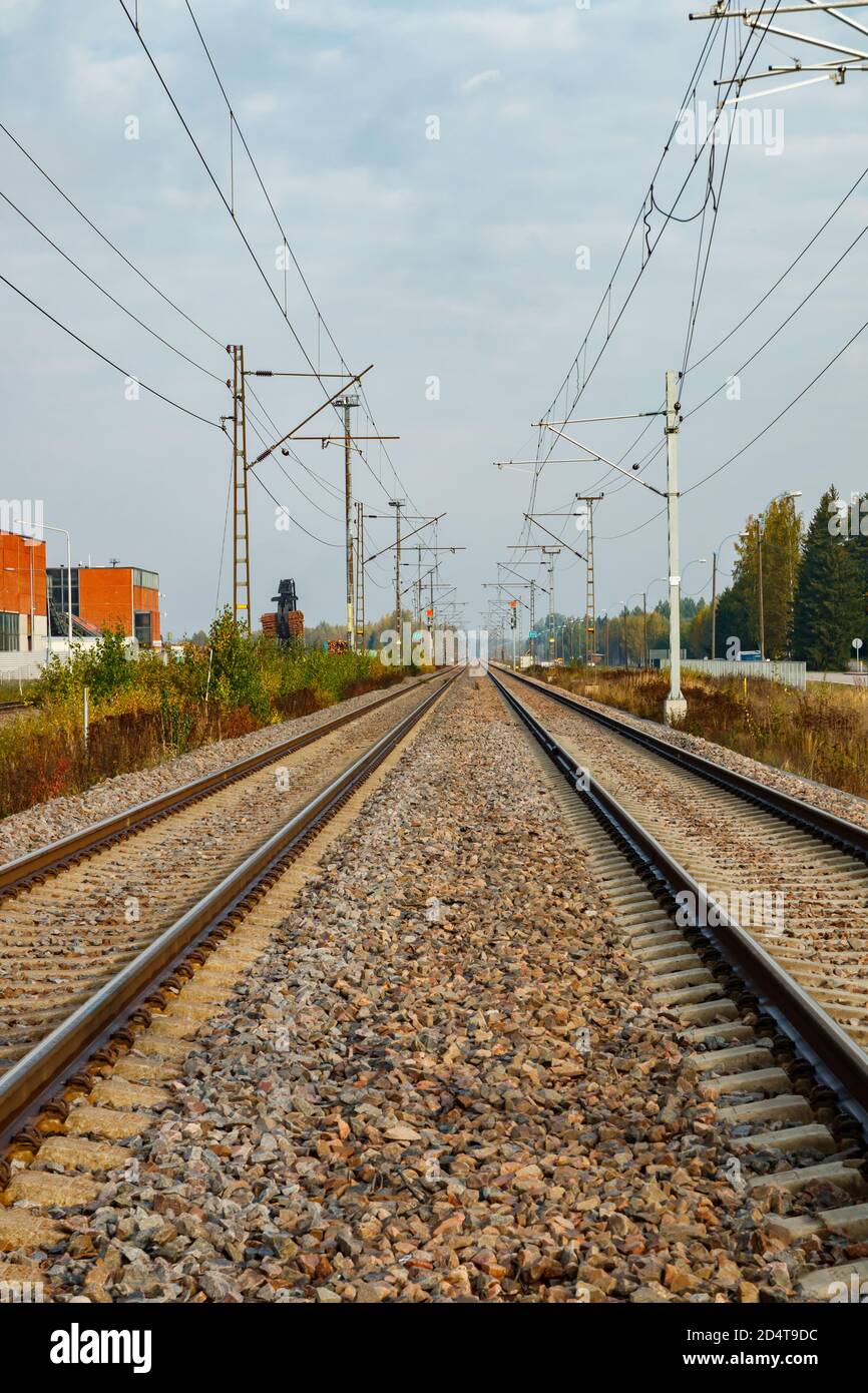 Two lane railroad with electric power lines Stock Photo - Alamy