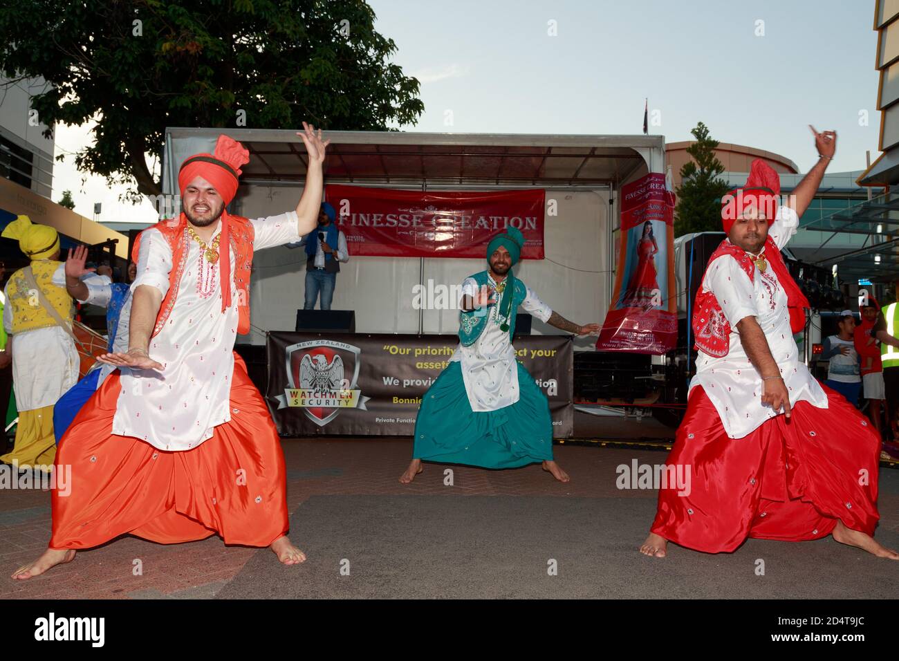 Indian men in traditional clothing dancing at Diwali festival. Tauranga ...