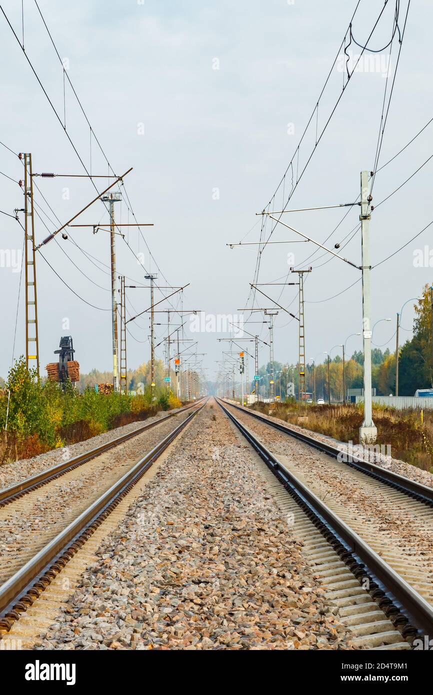 Two lane railroad with electric power lines Stock Photo - Alamy