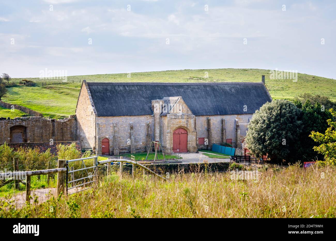 The large tithe barn at the ruins of Abbotsbury Abbey, a former ...