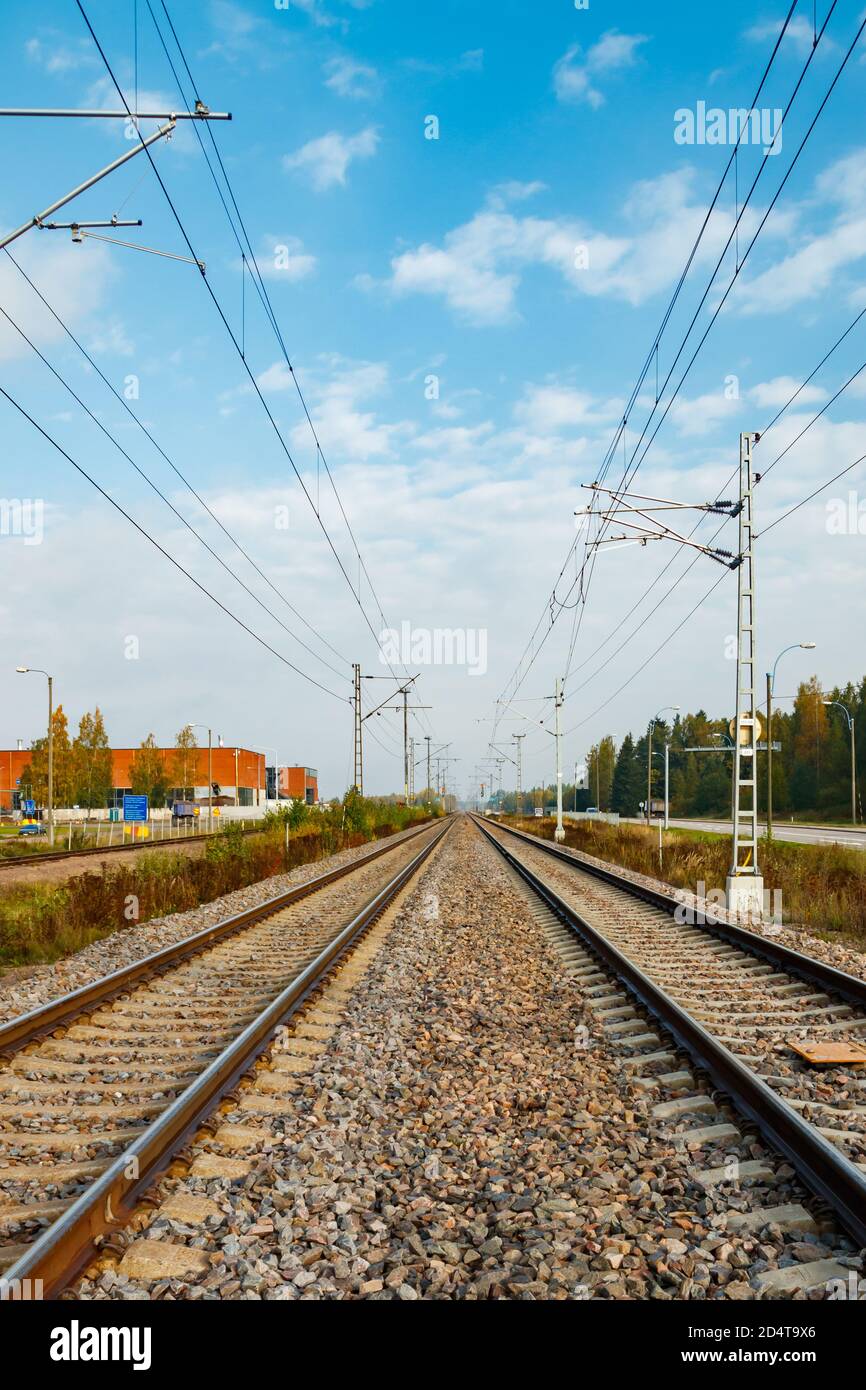 Two lane railroad with electric power lines Stock Photo - Alamy