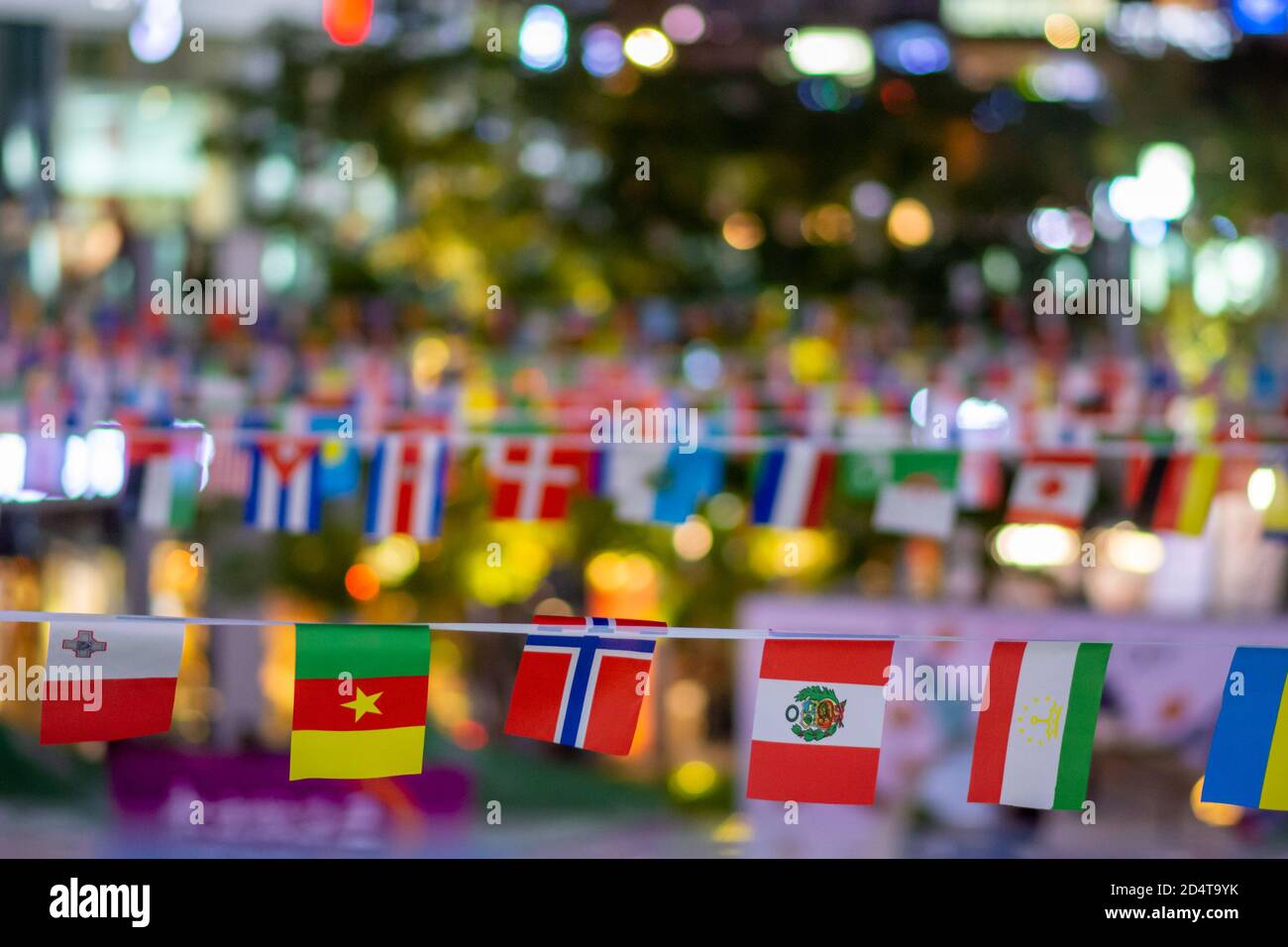 Selective focus of national flags of many countries with blurry ...