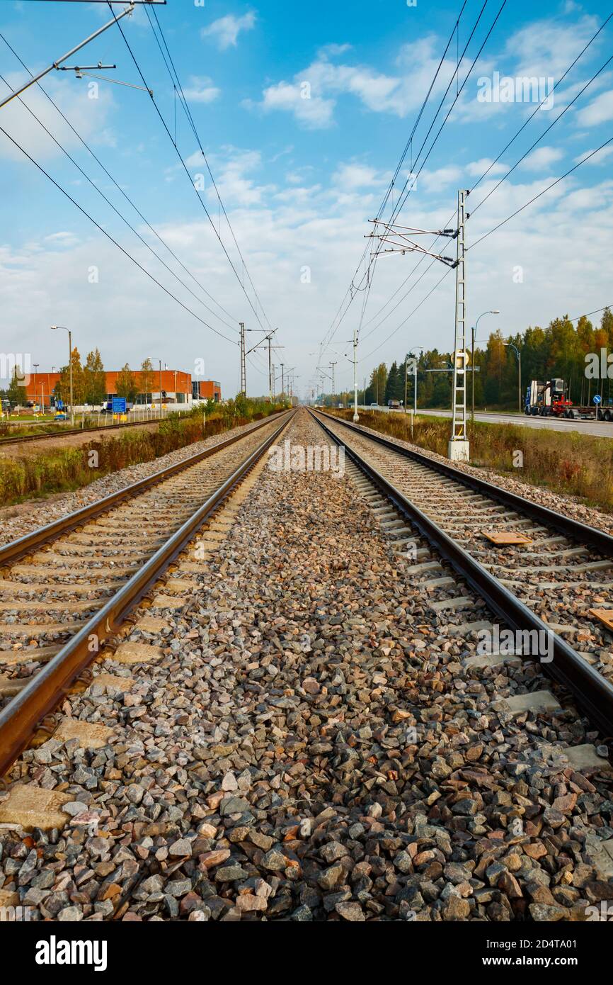 Two lane railroad with electric power lines Stock Photo - Alamy