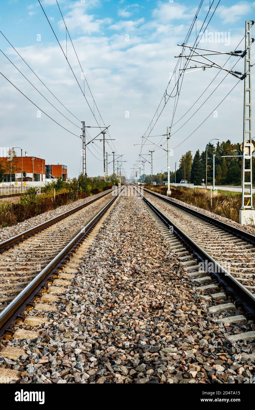 Two lane railroad with electric power lines Stock Photo - Alamy