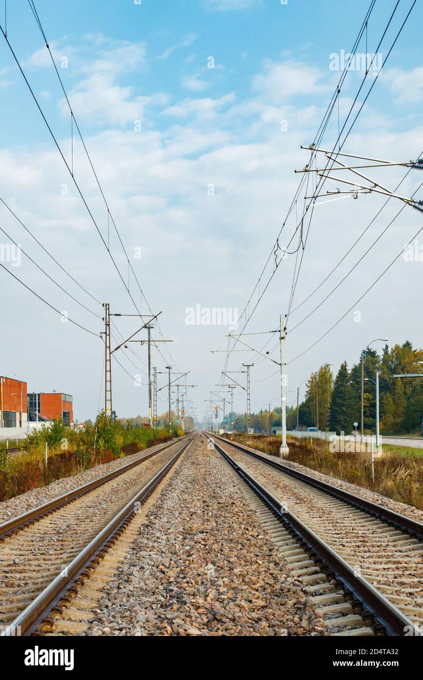 Two lane railroad with electric power lines Stock Photo - Alamy