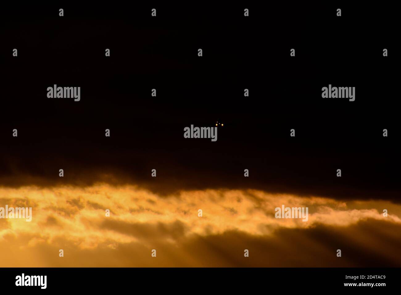 Silhouette airplane flying Stock Photo - Alamy