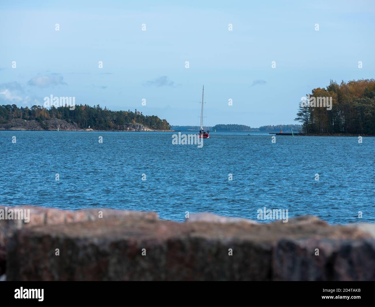 Helsinki/Finland - OCTOBER 10, 2020: A Sailboat sailing between two ...