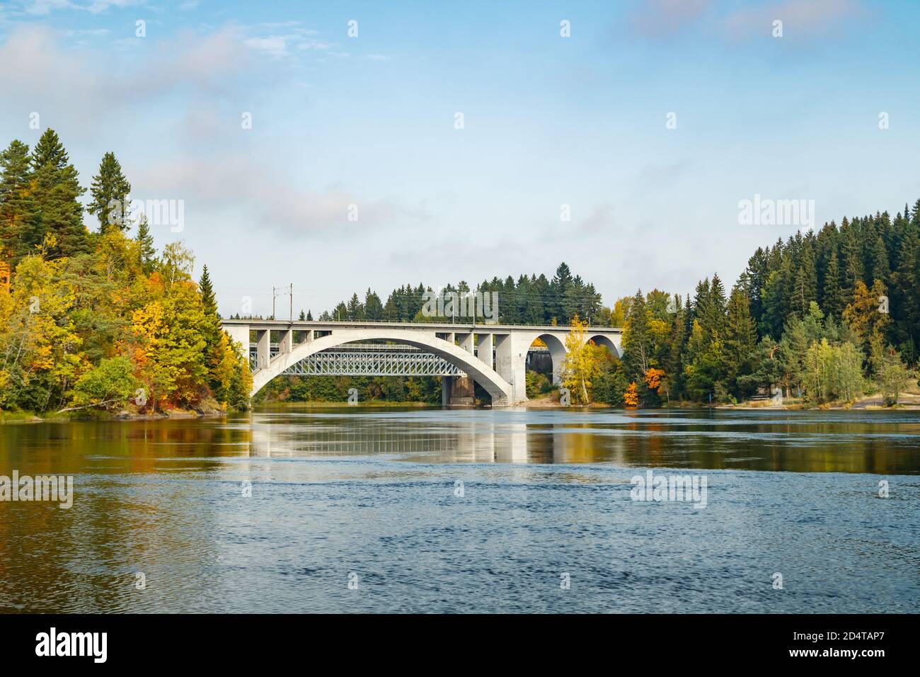 Autumn landscape of bridge and Kymijoki river waters in Finland ...