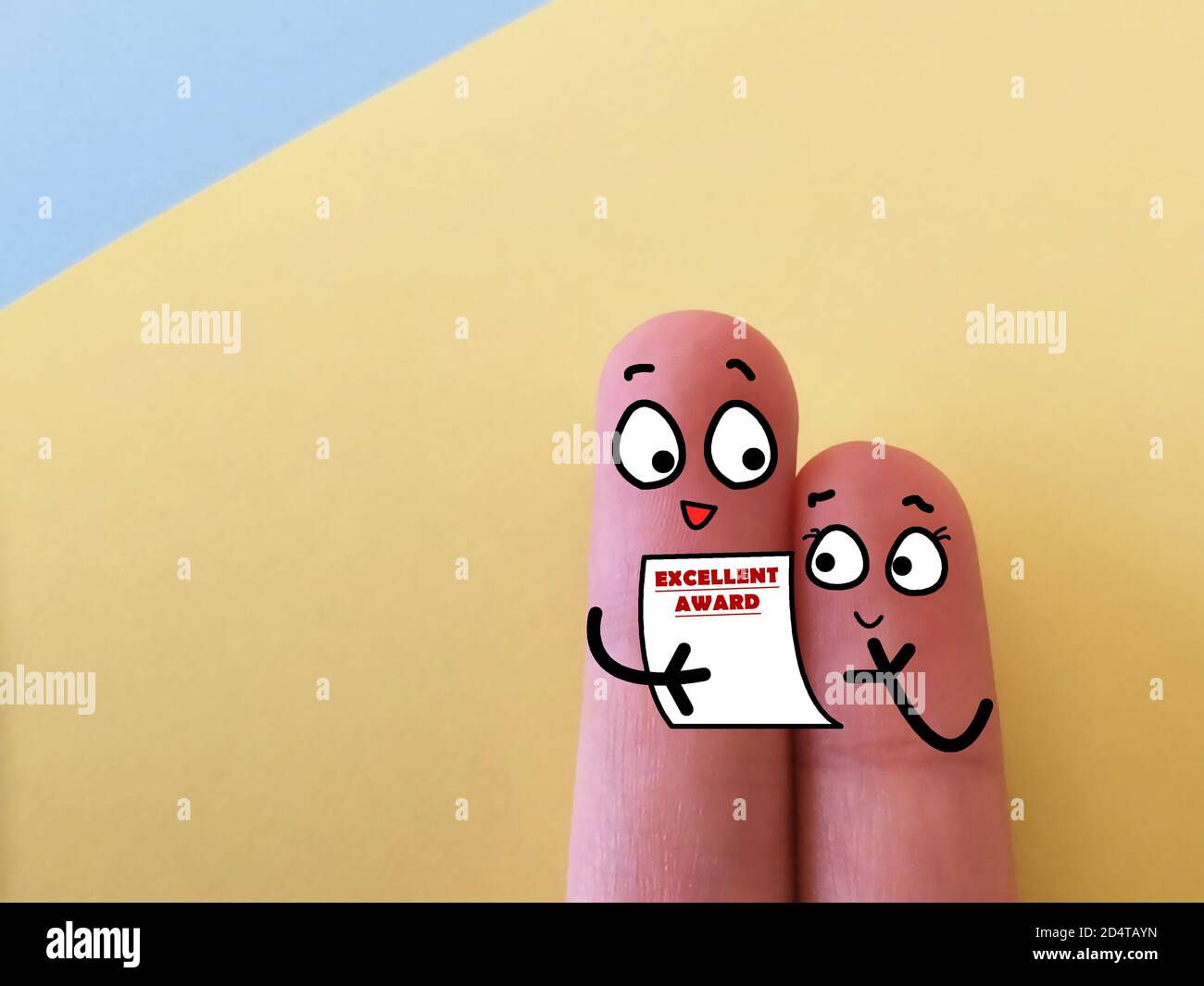 Two fingers are decorated as two person. They had received excellent ...