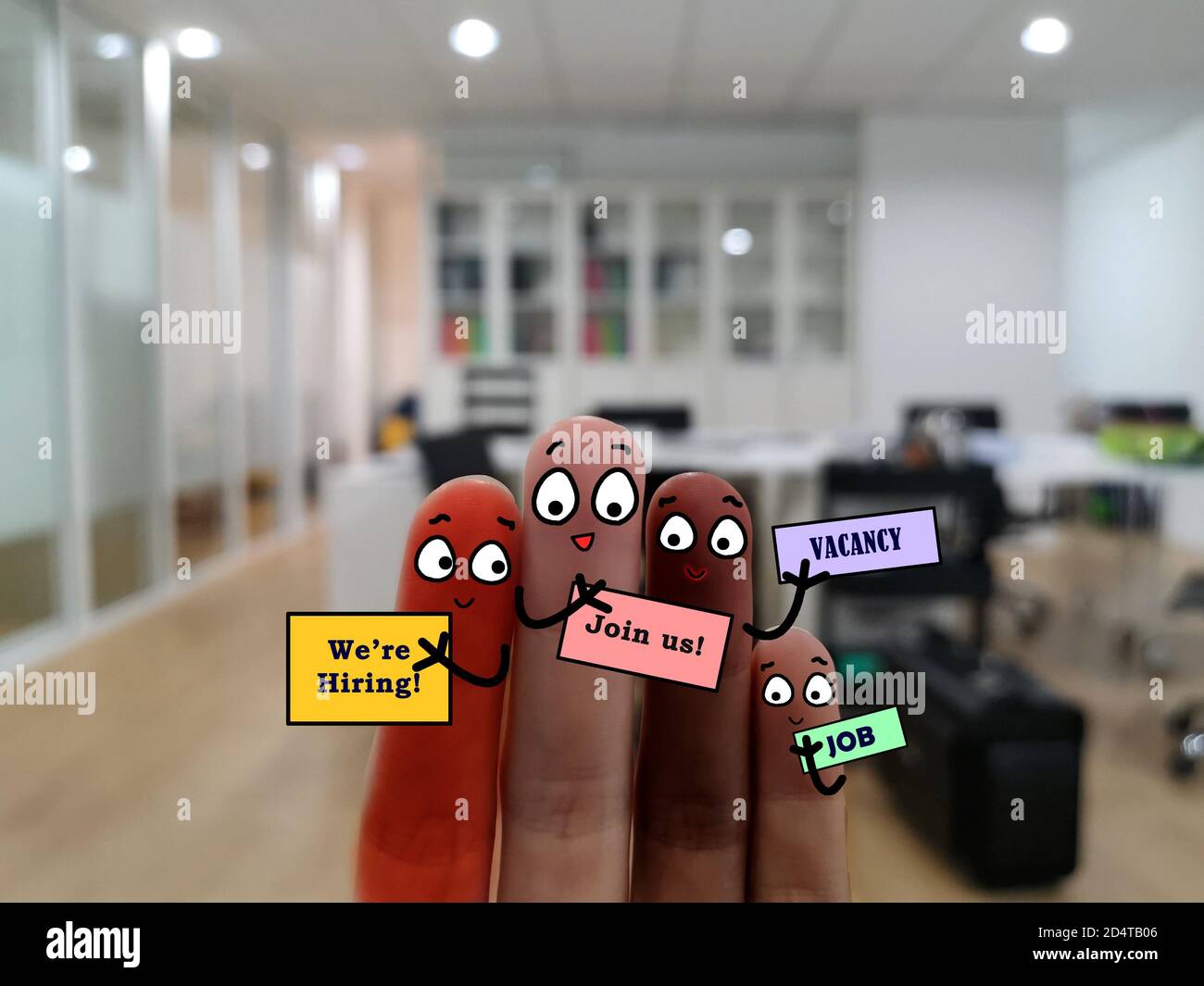 Four fingers are decorated as four expats from different countries ...