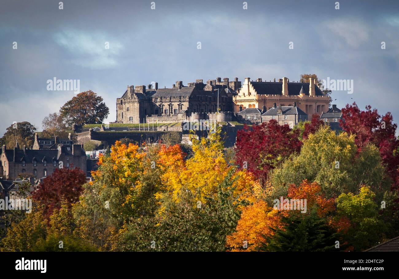 Stirling Castle surrounded by trees displaying their Autumn colours ...