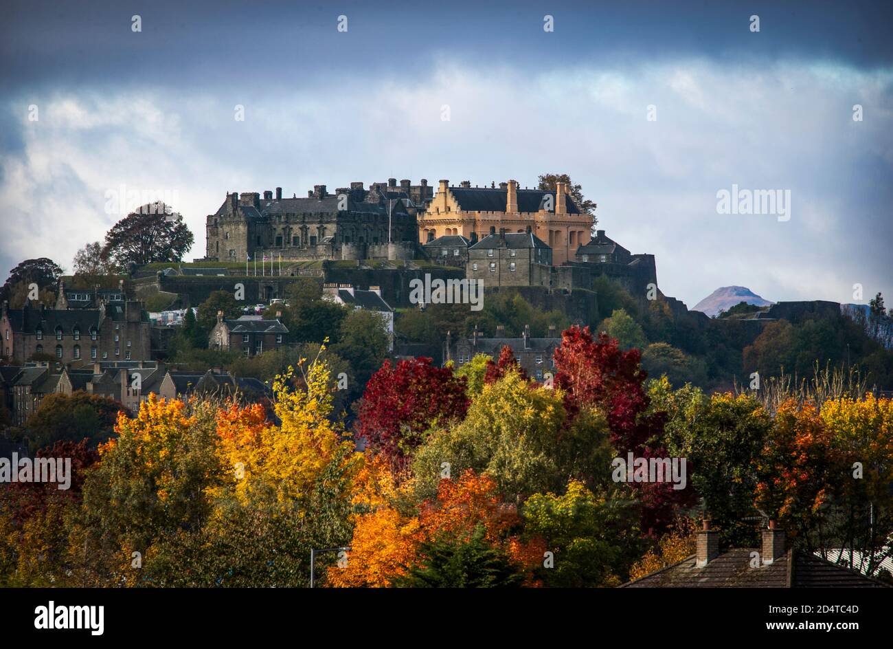 Stirling Castle surrounded by trees displaying their Autumn colours ...