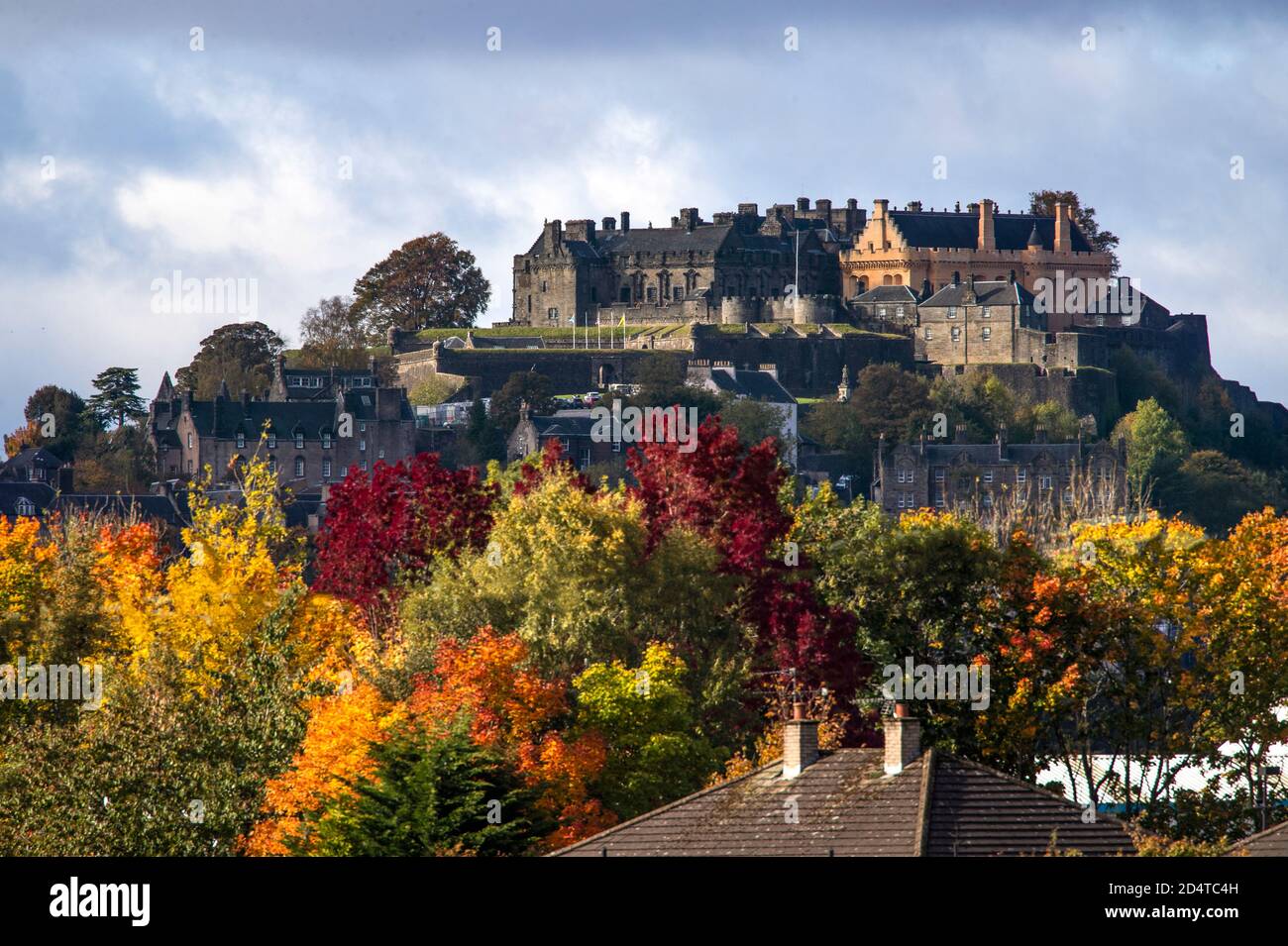 Stirling Castle surrounded by trees displaying their Autumn colours ...
