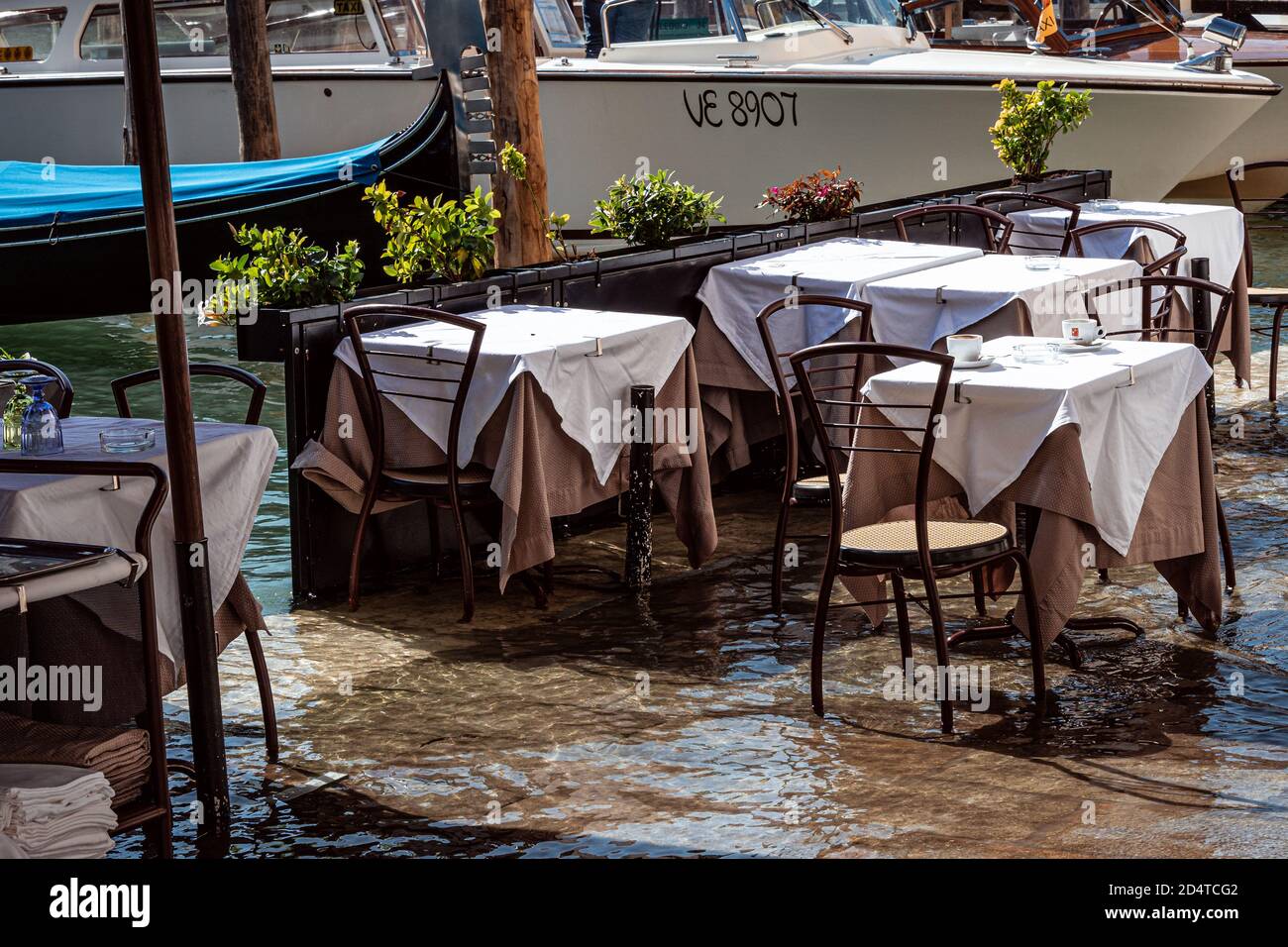 Flooded tables underwater at restaurant in Venice Stock Photo - Alamy