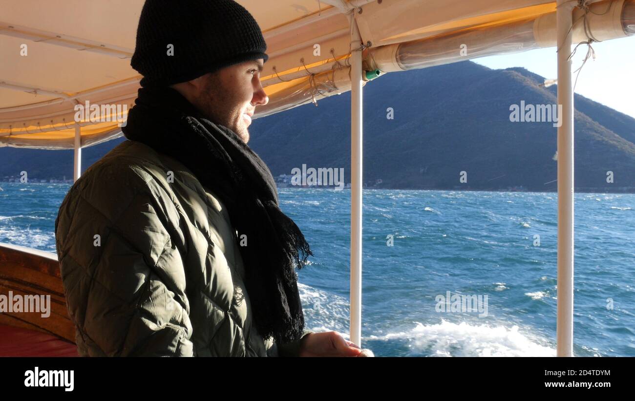 Tourist guy traveling on a boat in Adriatic sea Stock Photo - Alamy