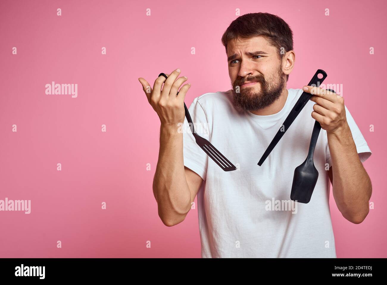sad man with kitchen tools in hands scoop scoop emotions Stock Photo ...