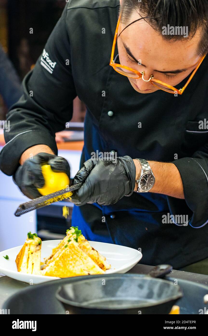 Chef Andrew Moo cooking egg and plant chorizo grilled cheese at the ...