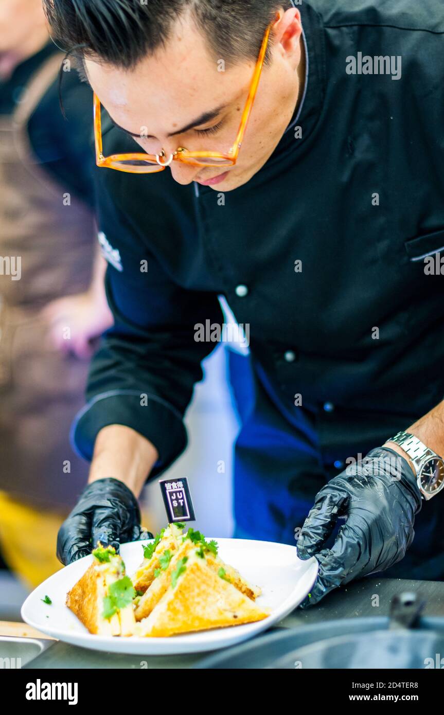 Chef Andrew Moo cooking egg and plant chorizo grilled cheese at the ...