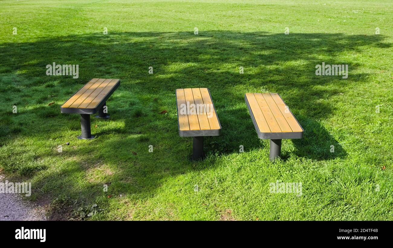 Three modern benches in a park (Gubbio, Umbria, Italy Stock Photo - Alamy