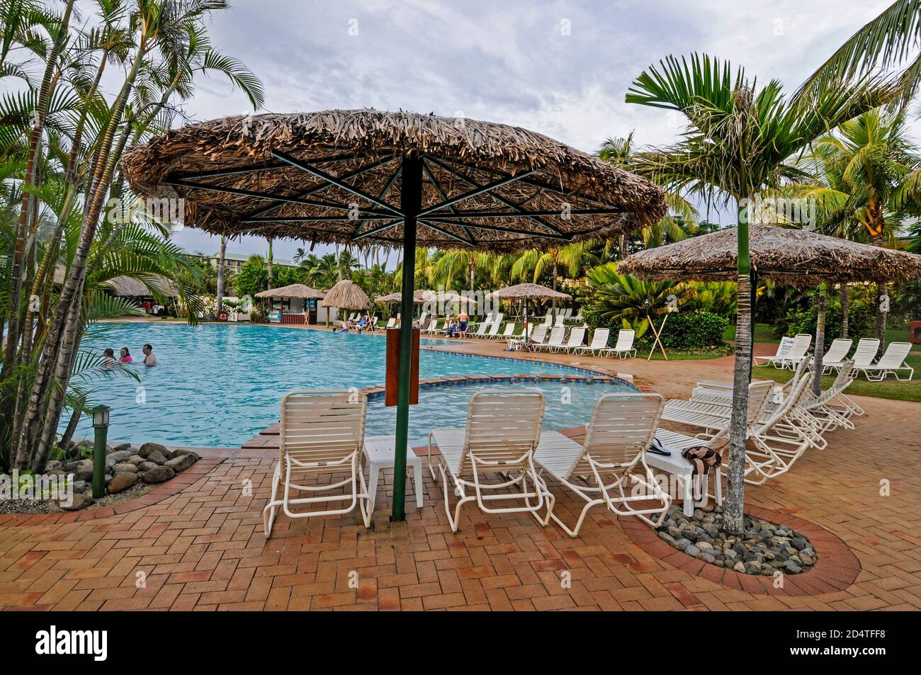 The main swimming pool at the Outriggers Fiji Beach Resort near ...
