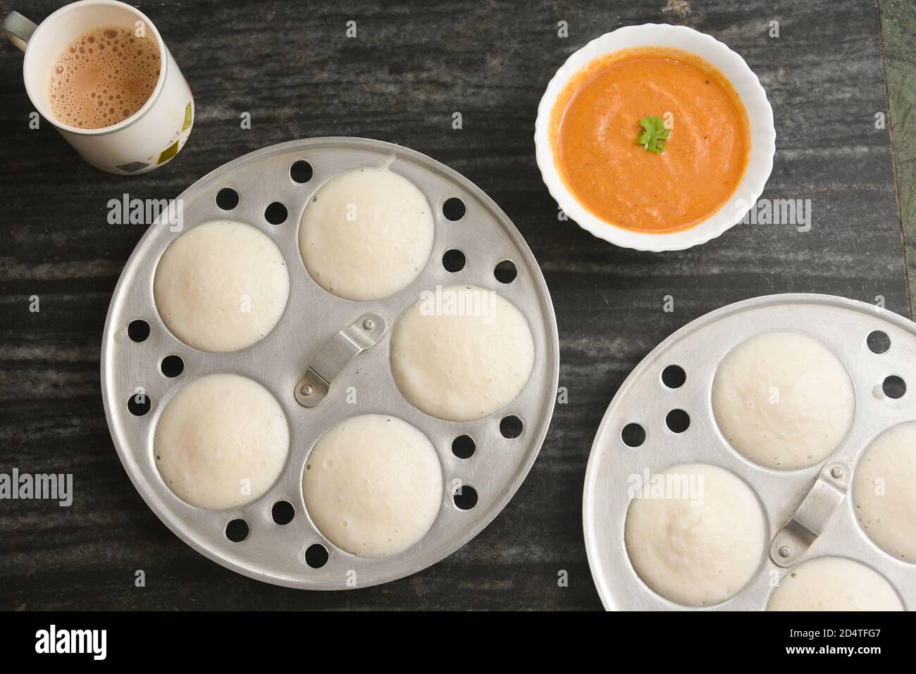 Indian idly served on traditional vegetarian food. Lots of many fresh ...