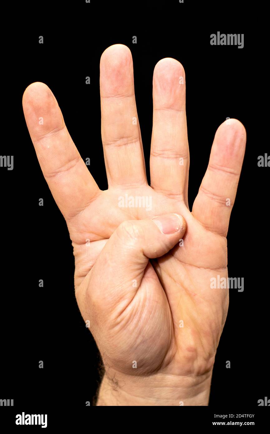 Male hand showing four fingers hi-res stock photography and images - Alamy