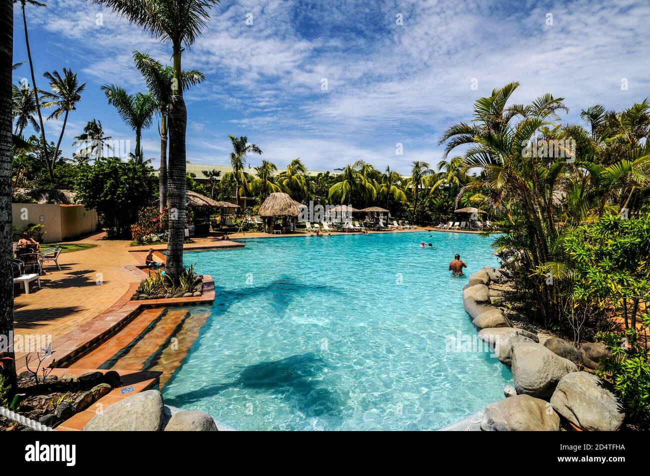 The main swimming pool at the Outriggers Fiji Beach Resort near ...