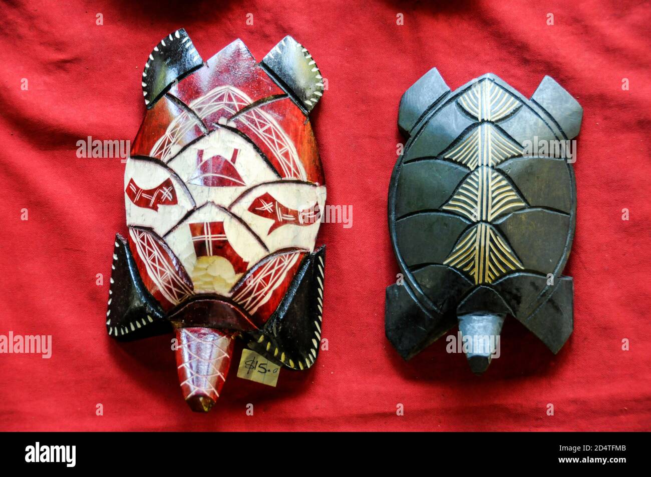 Hand-carved wooden turtles made from local wood on sale to tourists in ...