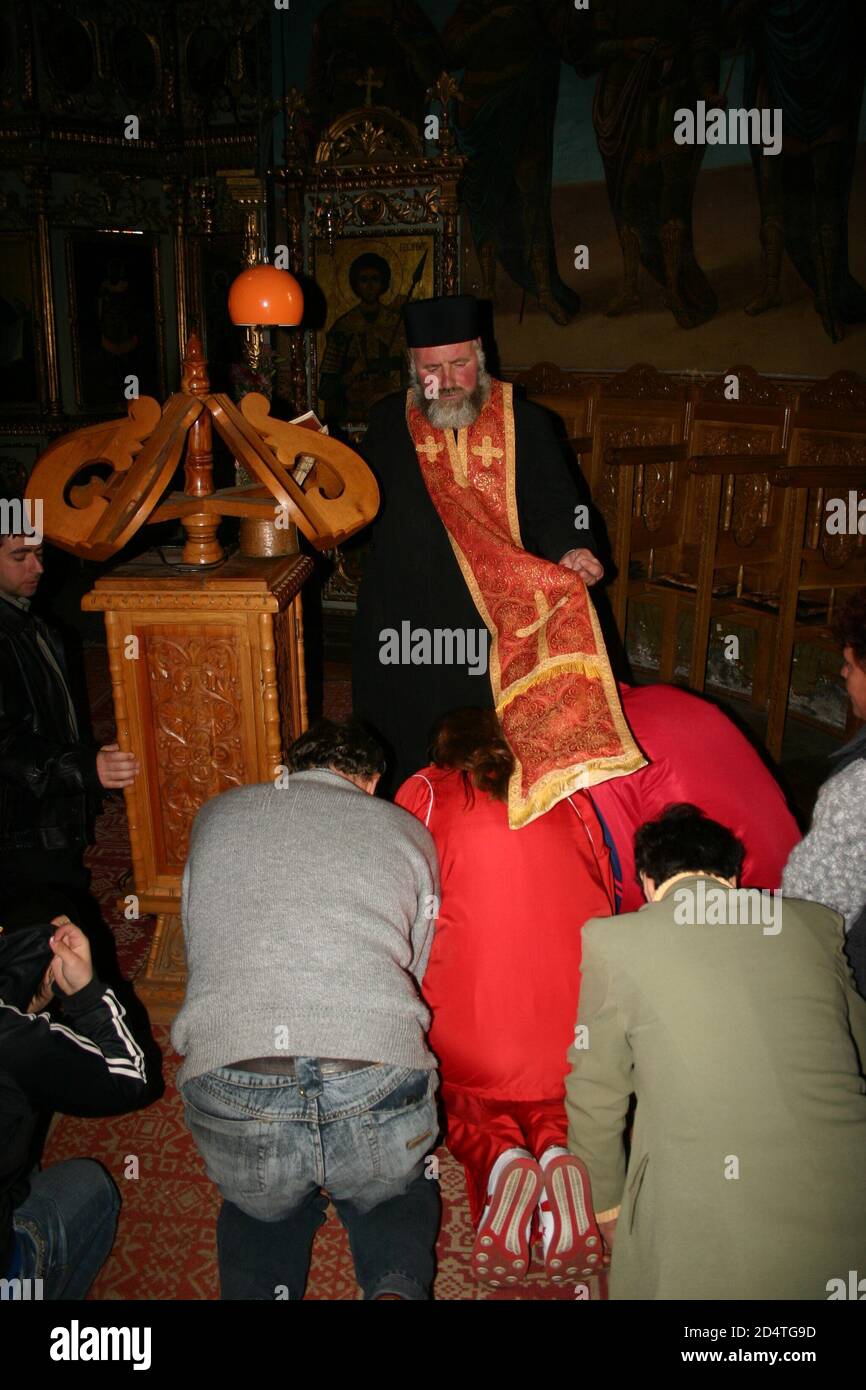Priest kneeling and praying hi-res stock photography and images - Alamy