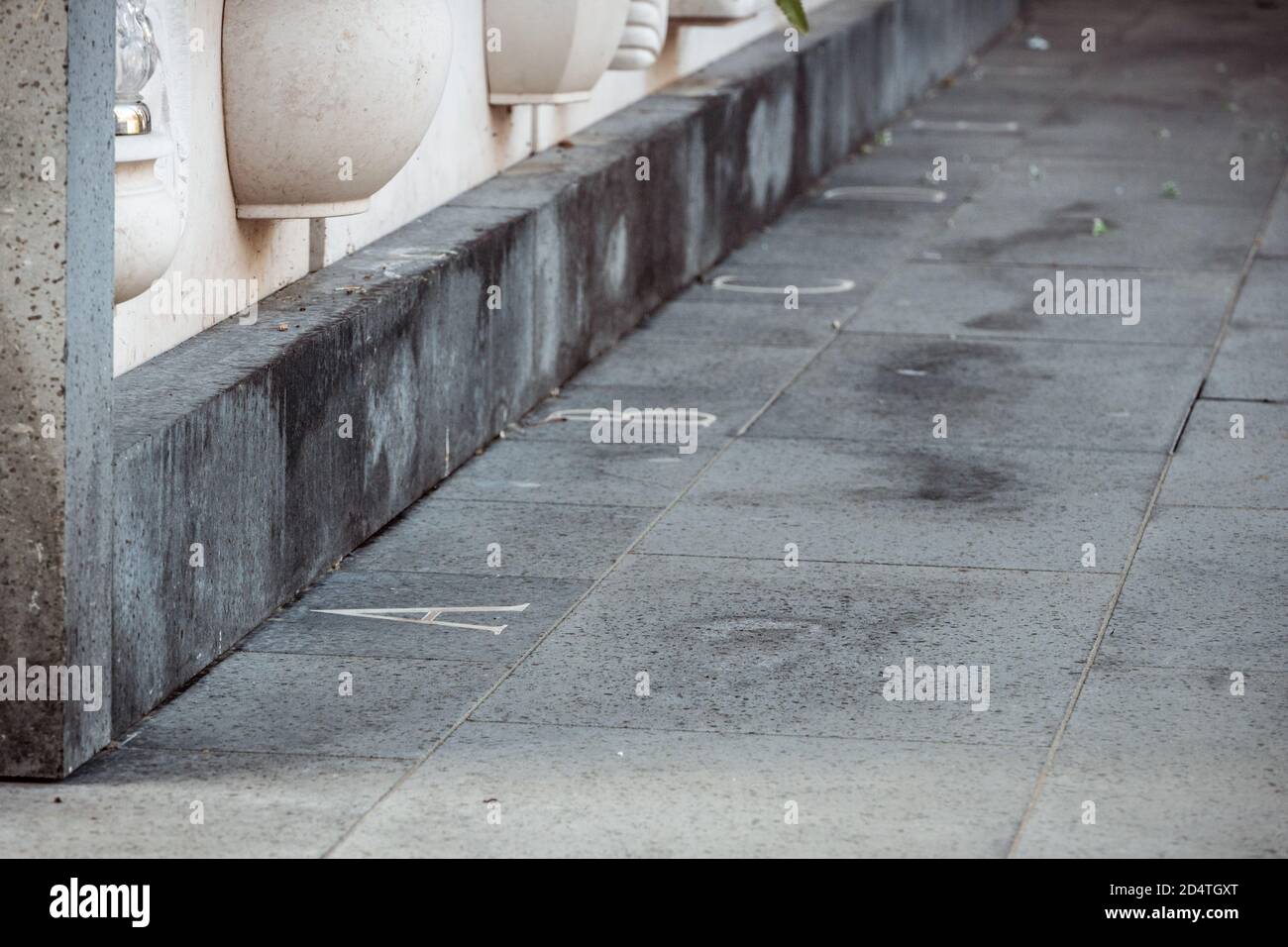 alphabetical lettering on ground of cemetery floor Stock Photo - Alamy