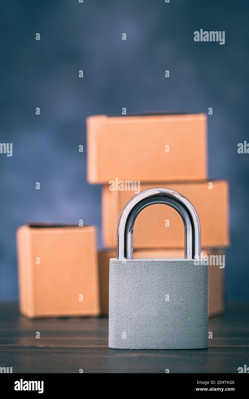 Metal lock in front of boxes Stock Photo - Alamy