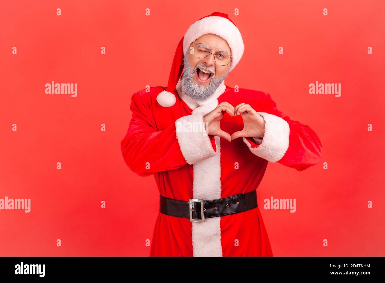 Portrait of friendly positive santa claus in eyeglasses with gray beard ...