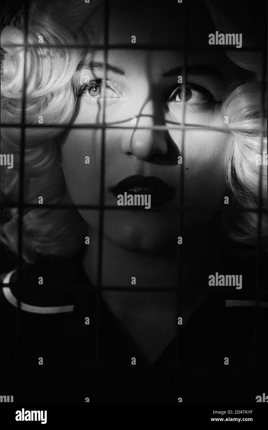 sad scared blonde behind bars close up portrait, monochrome Stock Photo ...