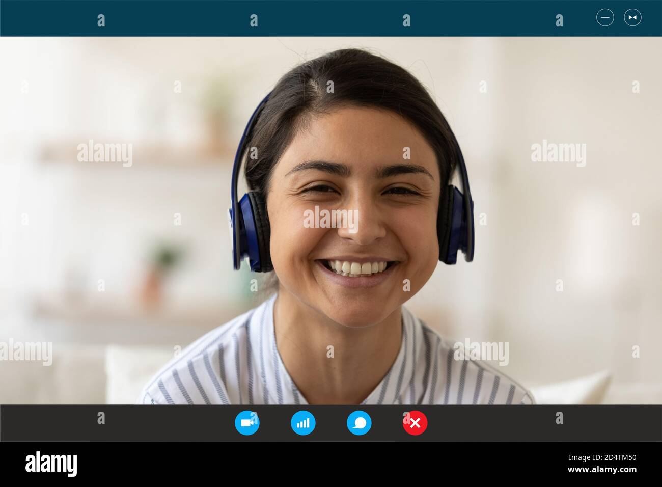 Overjoyed Indian woman in headphones have video call Stock Photo - Alamy