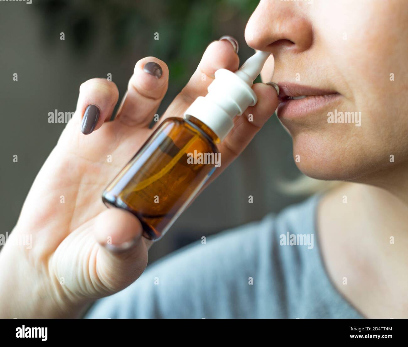 Woman using nasal spray close up. Health care concept Stock Photo - Alamy