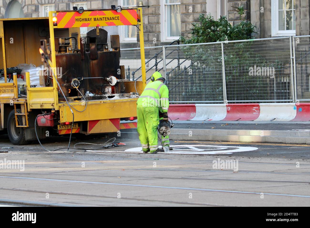 Road Maintenance Workers Applying Twenty Mile Per Hour Road Paint on ...