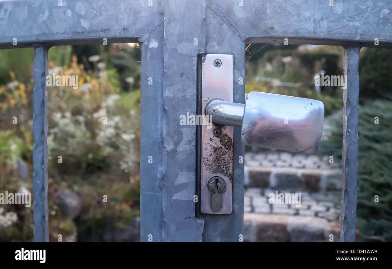 Closeup shot of a square metal gate handle Stock Photo - Alamy
