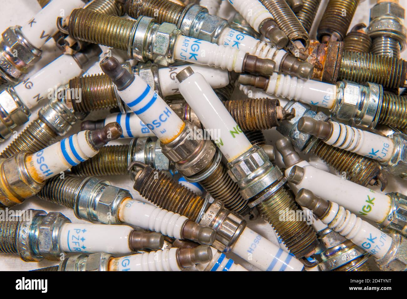 discarded spark plugs in a pile Stock Photo - Alamy